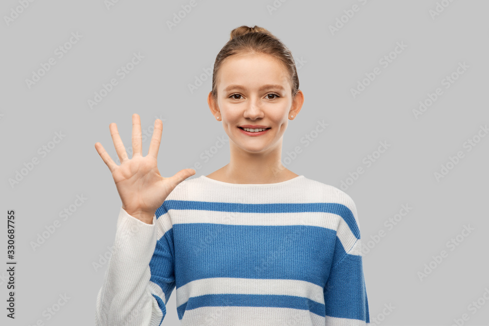 gesture, finger counting and people concept - smiling teenage girl ...