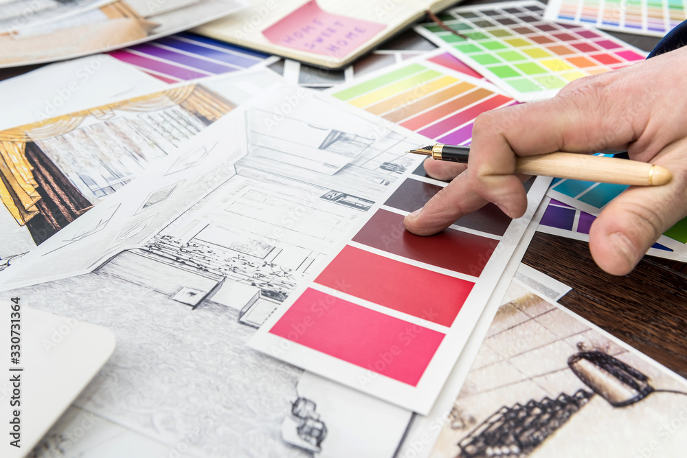 Home designer work at office house sketch with color catalog for dream ...