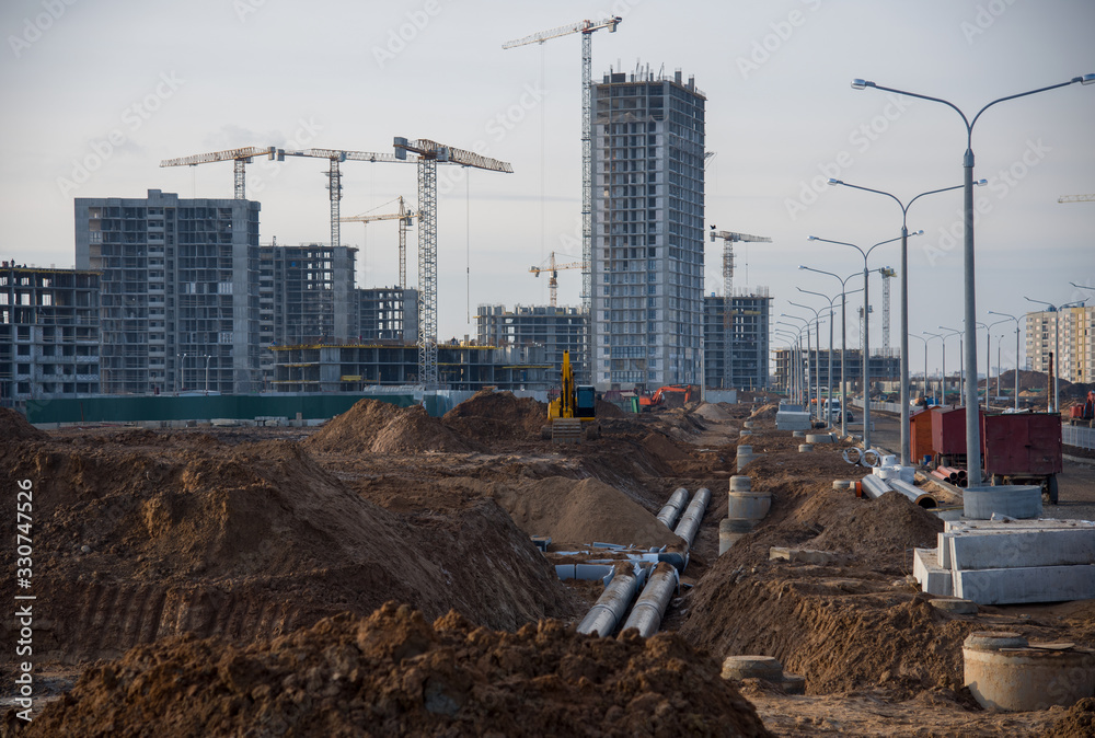 Drainage pipes at the large scale construction site against tower ...
