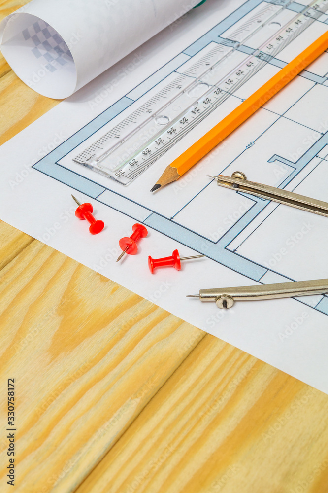 Rolled house diagrams and accessories for drawing lying on construction ...