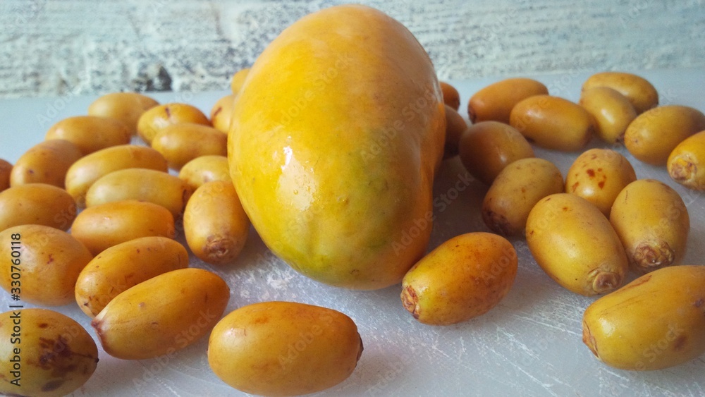 Fresh, Crunchy, Sweet Yellow Barhi Dates and Mango | Yellow, Semi-Ripe ...