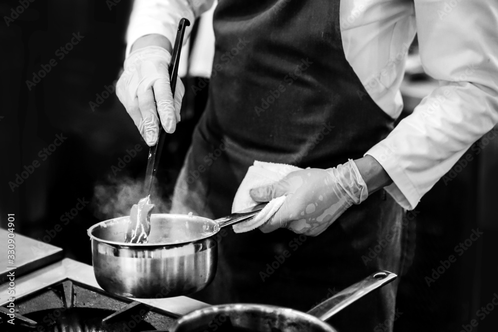 Chef cooking in a kitchen, chef at work, Black and White. Stock Photo ...