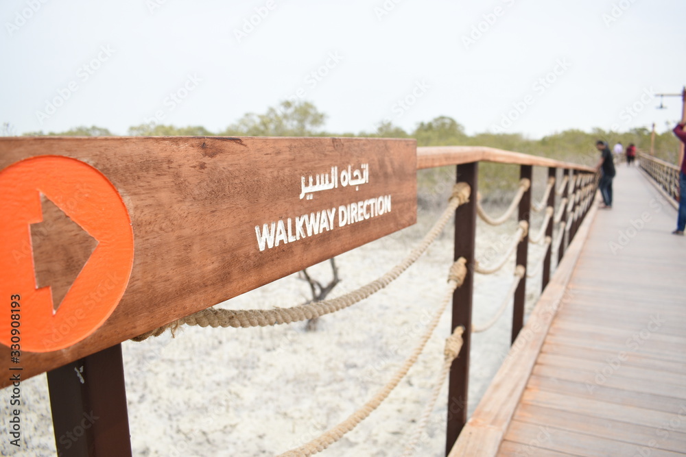 Walkway direction board in Al Jubail Mangrove park.It is a exiting ...