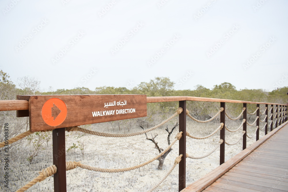 Walkway direction board in Al Jubail Mangrove park.It is a exiting ...