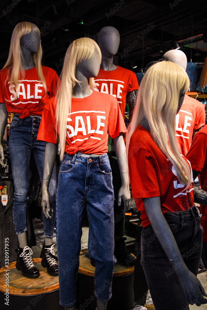 Mannequins in a window of a clothing store in T-Shirts With Signs ...
