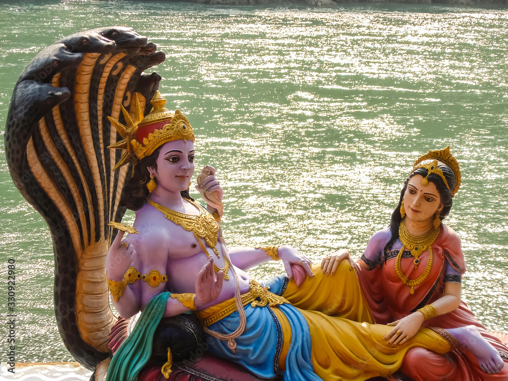 Rishikesh, India. Beautiful statues of Lord Vishnu and Lakshmi at the ...