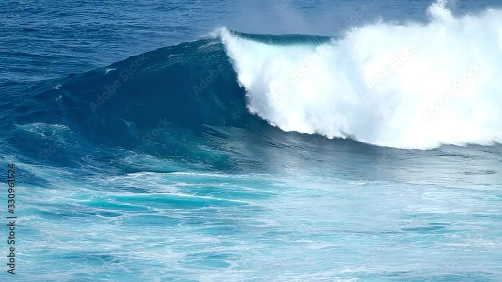 Huge ocean wave breaks at the famous Jaws (Peahi) surf spot in Maui ...