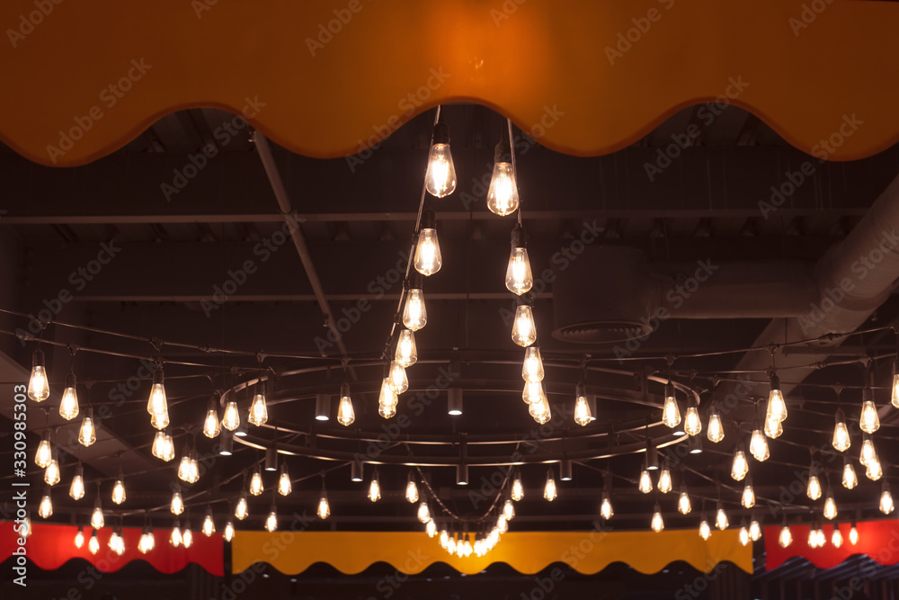 Inside of the circus. Circus style interior with many lamps and ...