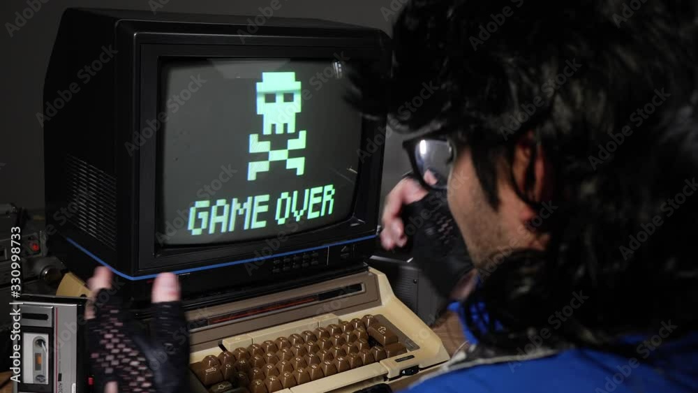 Upset, mad computer geek getting frustrated and hitting old concept ...