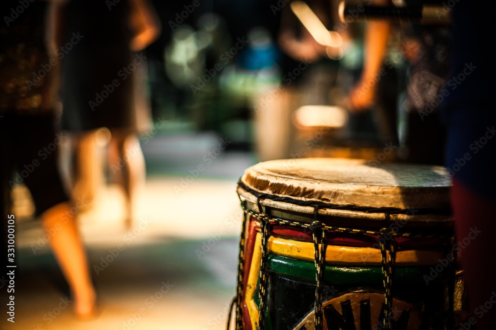 A close up selective focus view of a colorful Arfican doun doun drum ...