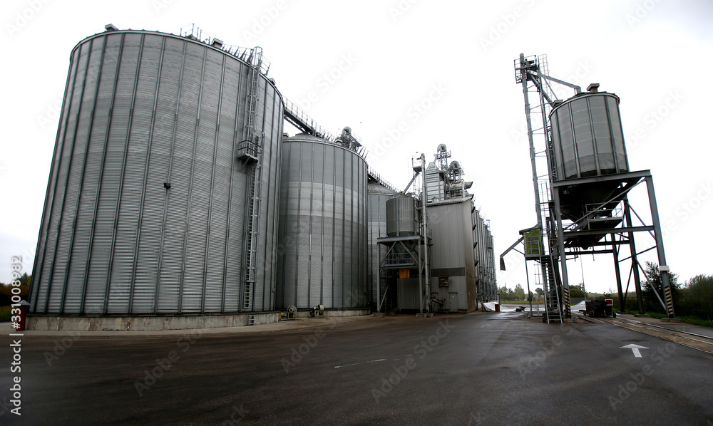 exterior of big silo technology in sun beam light in agriculture life ...