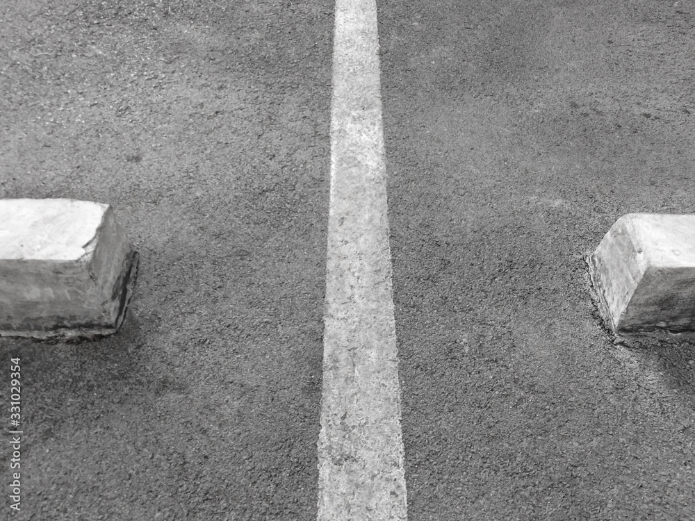 Asphalt road with desaturate and stop bumper on the street for safety ...