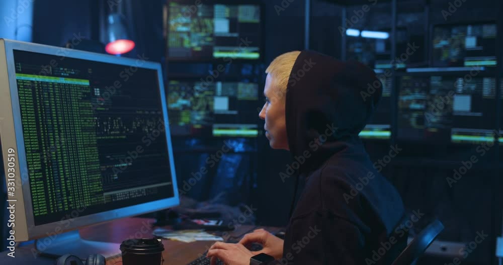 Back and side view on female Caucasian cyberpolice officer working on ...