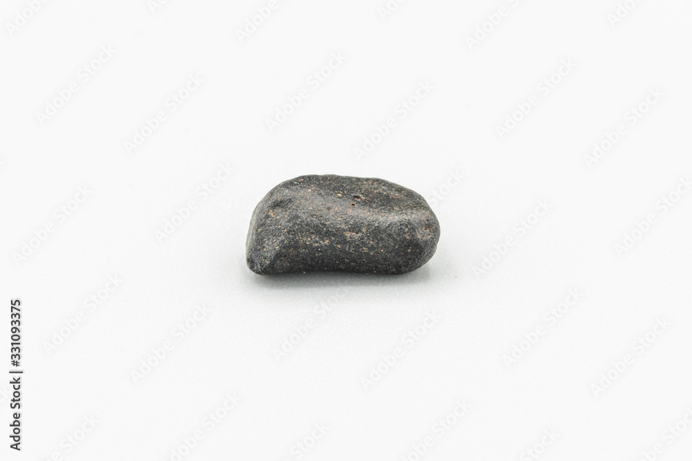 Black magnetic Atacaimite Tektite Meteorite isolated, a rock formed in ...