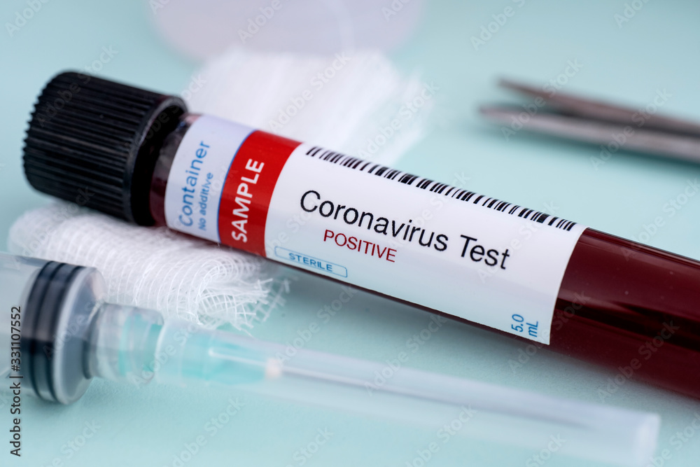 Testing for presence of coronavirus. Syringe with vaccine and tube ...