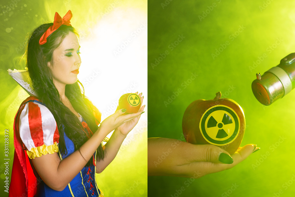 Woman dressed as Snow White holds Radioactive atomic nuclear ionizing ...
