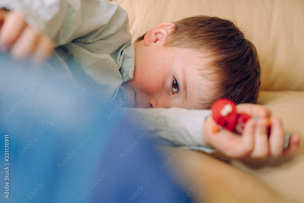 Grounded little boy at home with no school. Portrait of small kid with ...