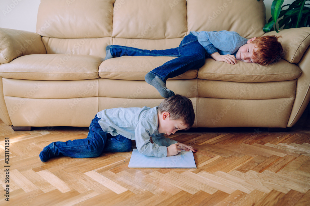 Bored siblings at home playing with each other on the house isolation ...