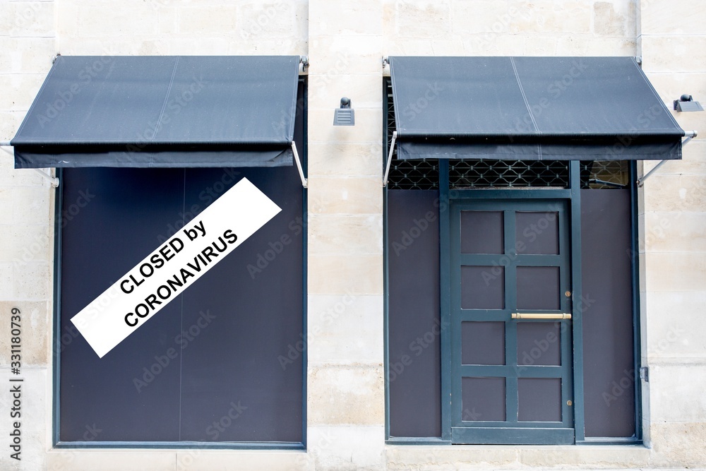 two shop windows and dark blinds store closing on a shop window due to ...