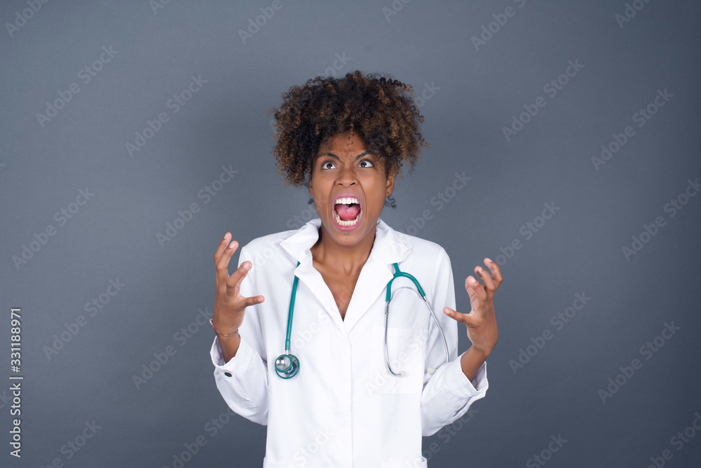Screaming, hate, rage. Crying emotional angry doctor woman screaming on ...