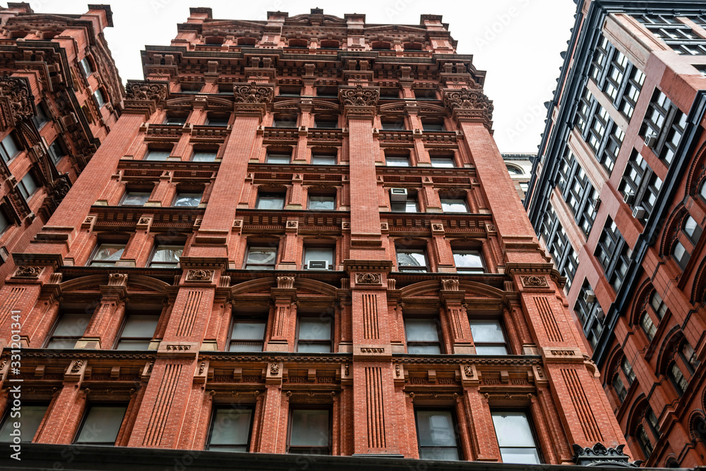 facade of a typical ancient red brick building in Manhattan, New York ...