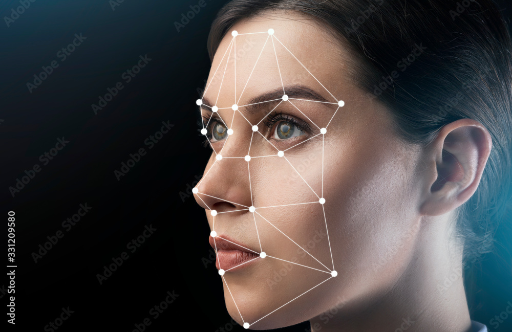 Beautiful woman with scanning grid on her face against black background ...
