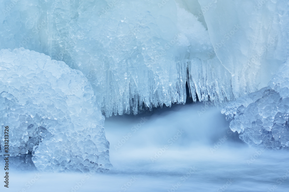 Winter landscape of the Rabbit River cascade captured with motion blur ...