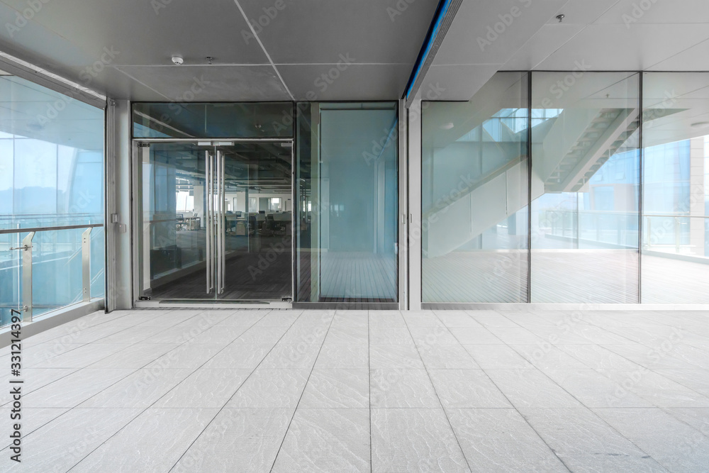 A modern office building with glass doors and windows Stock Photo ...