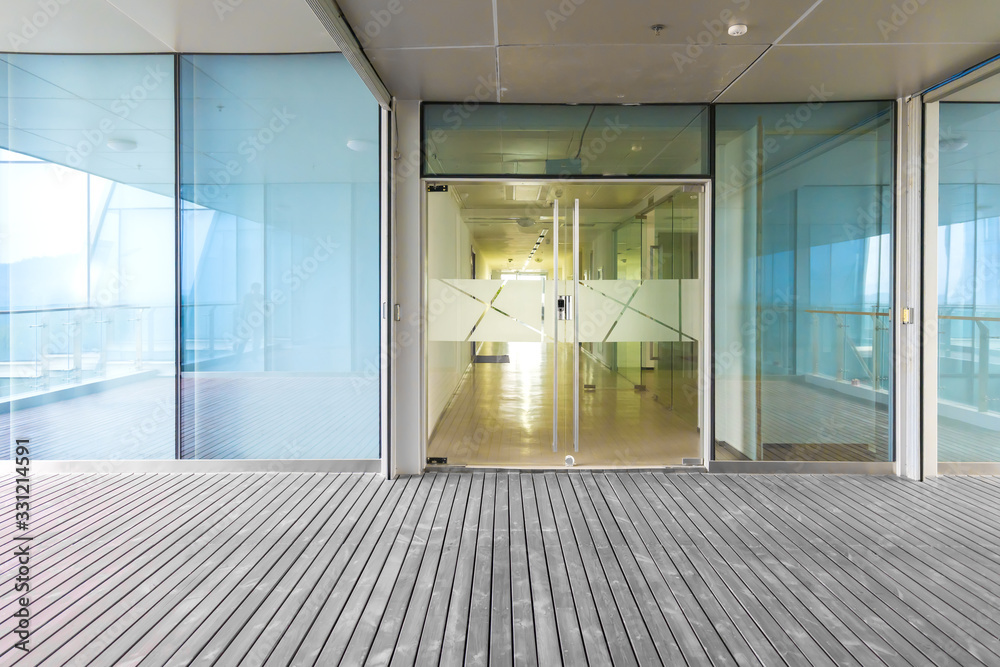 A modern office building with glass doors and windows Stock Photo ...