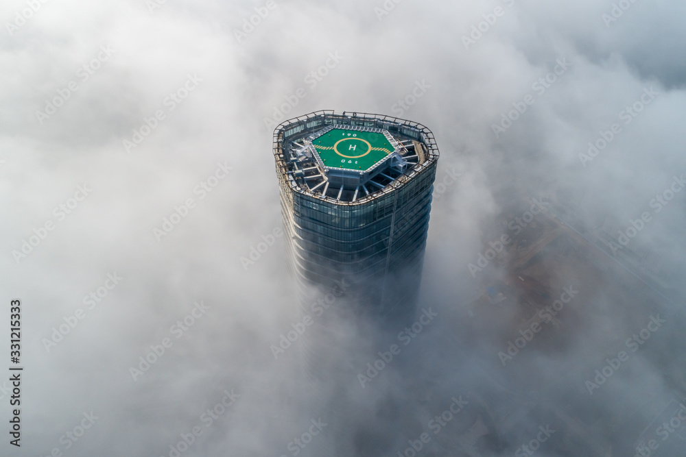 Helipads on the roofs of urban high-rise buildings shrouded in ...
