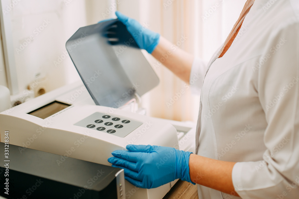 Blood test process in laboratory. Test-tube centrifuge and doctor ...