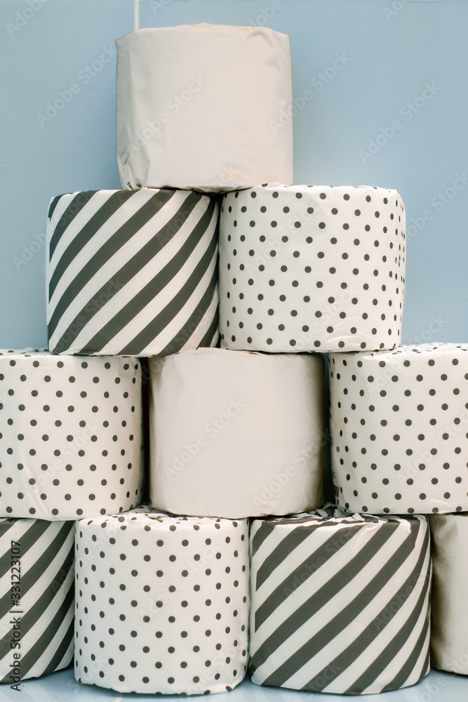 Pyramid of Stock Piled Toilet Paper Rolls in Patterned Wrap in a ...