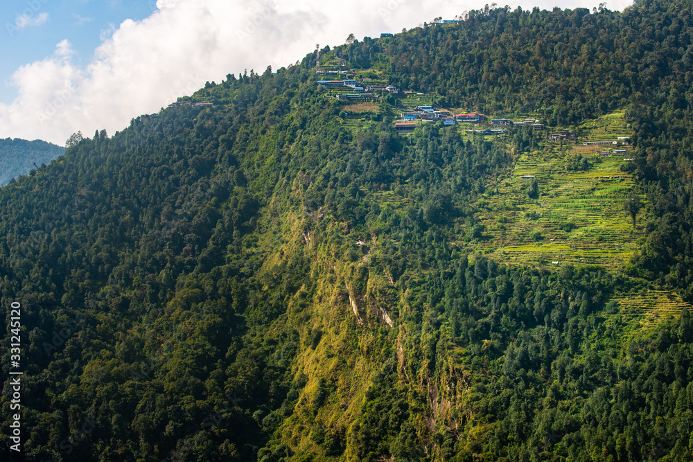 View of Chomrong village on the edge of mountain in Annapurna Sanctuary ...