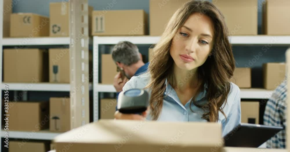 Caucasian beautiful woman walking in post office store at shelves with ...