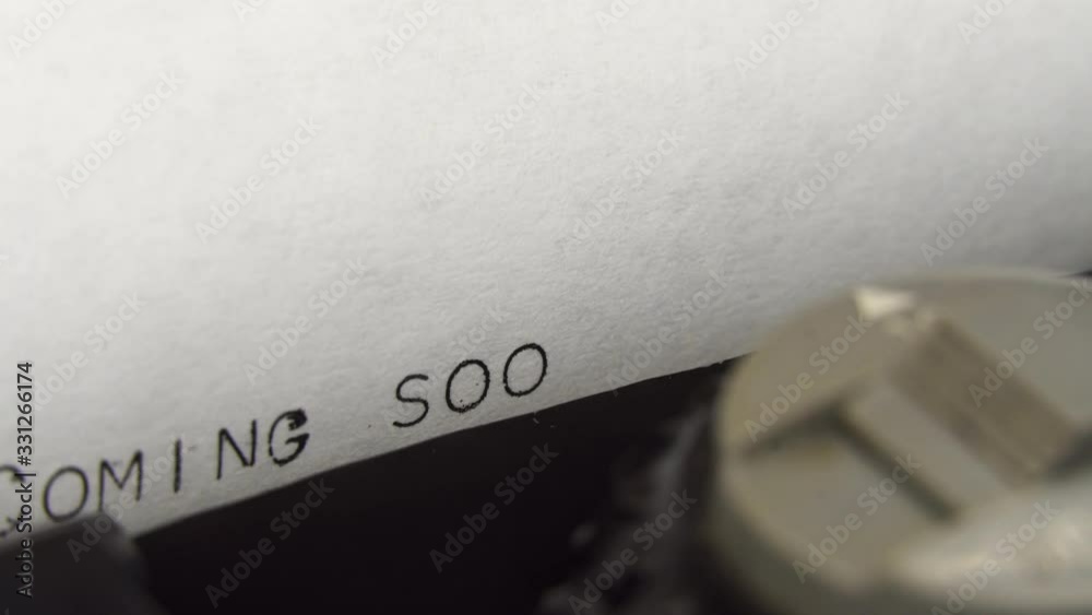 Typing COMING SOON in black ink on an old mechanical typewriter. Stock ...