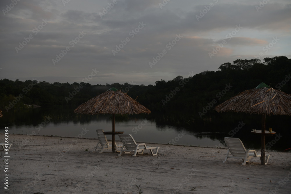 sandy beach at dawn on one of the tributaries of the Amazon in Brazil ...