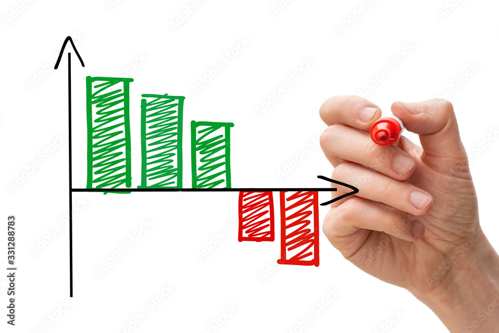 Financial crisis concept. Male hand drawing a declining chart on a ...