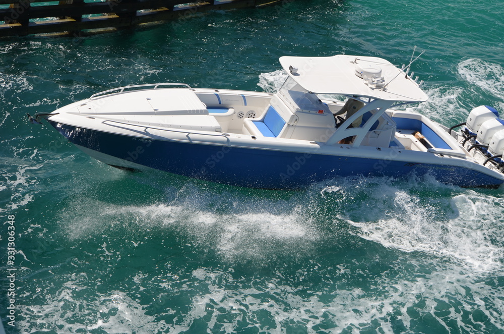 High-end sport fishing boat powered by four outboard engines Stock ...
