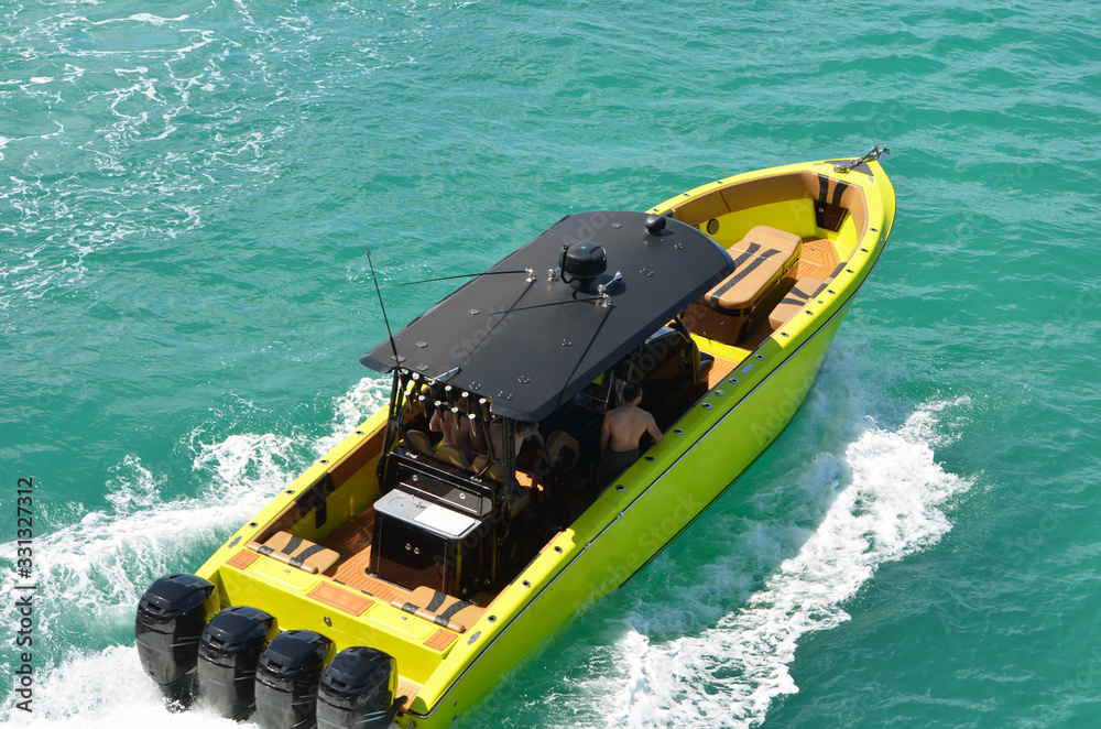 Overhead view of a high-end sport fishing boat powered by four outboard ...