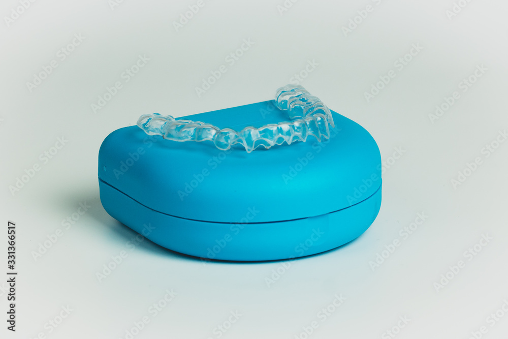 Blue carrying case for orthodontic retainer made from transparent ...