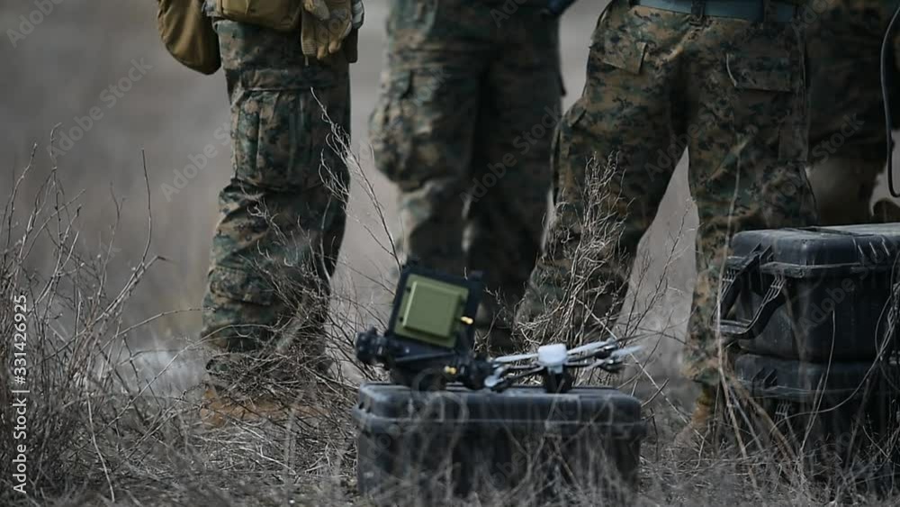 US army soldier holding automatic rifle in defense position during ...