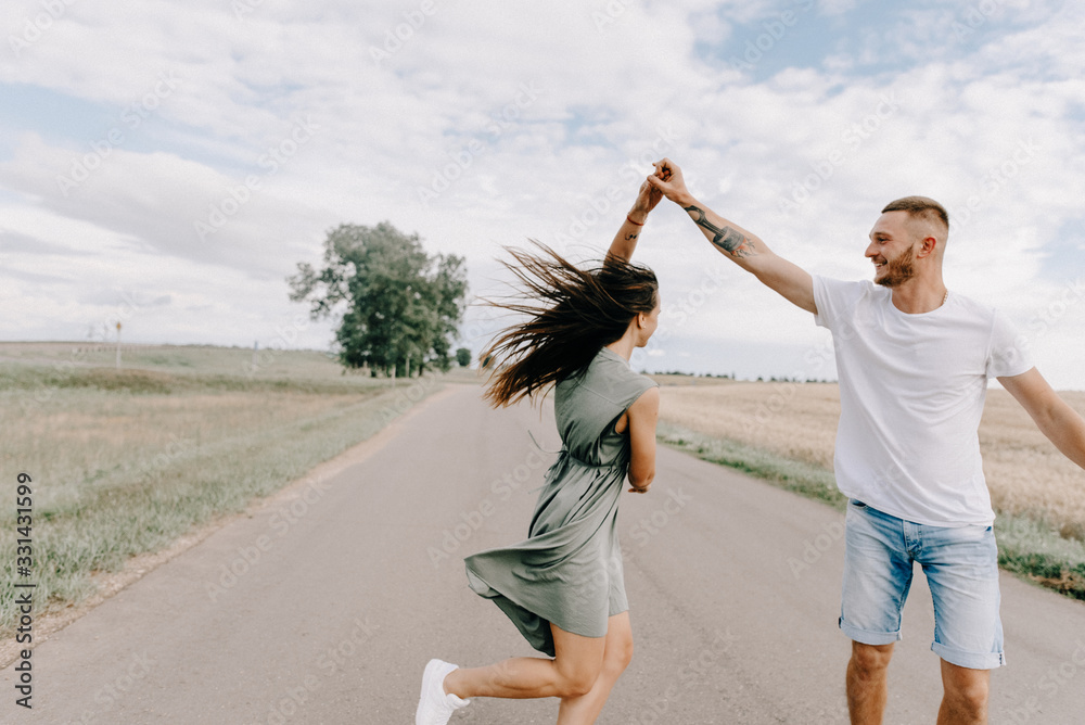 Romantic young couple sharing a special moment while on a road trip.Man ...