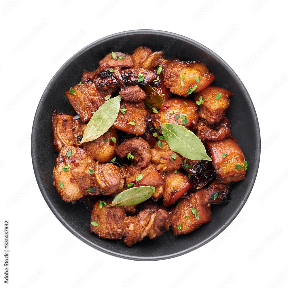 Adobo Pork in black bowl isolated on white background. Pork Adobo or ...