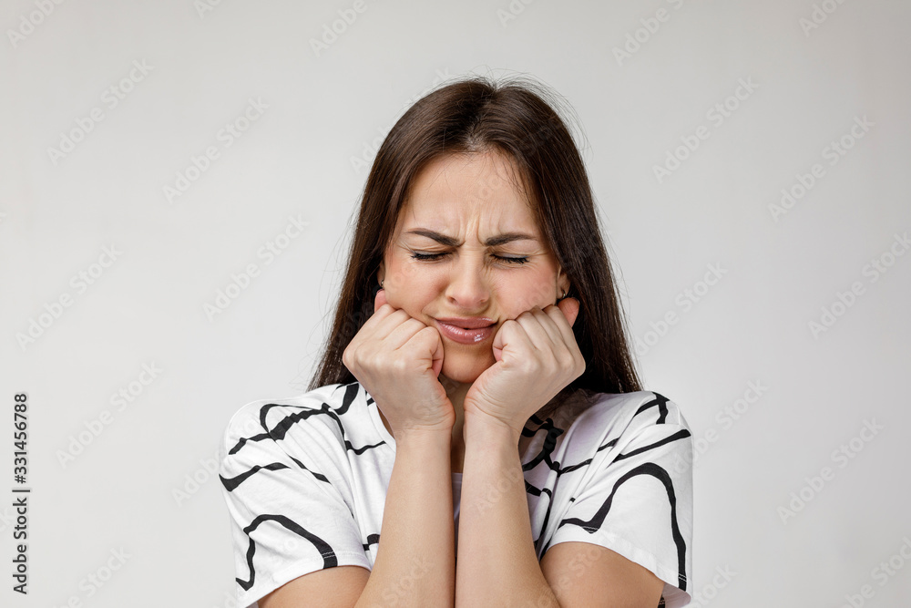 young sad woman suffering from tooth pain, caries. girl having ...