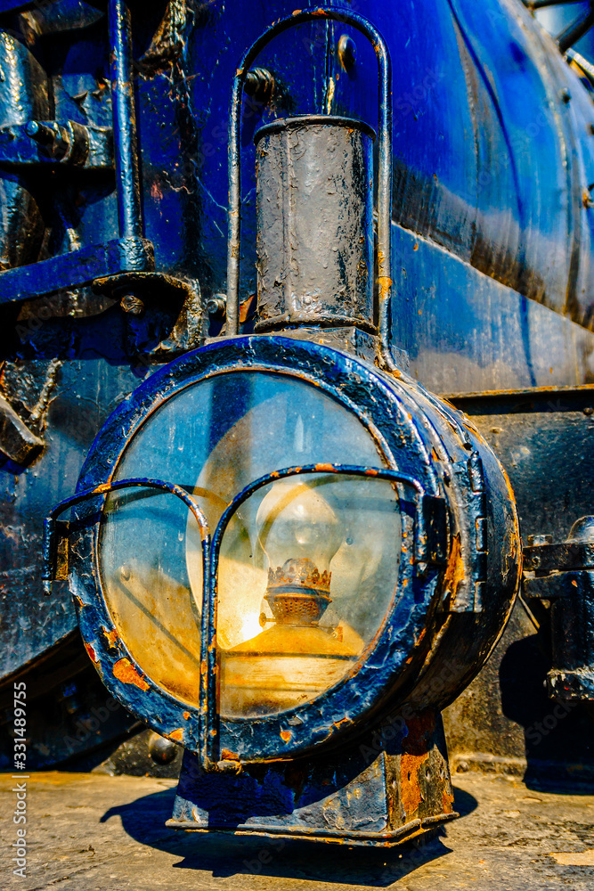 Headlight of a vintage steam locomotive of a pre-electricity age ...
