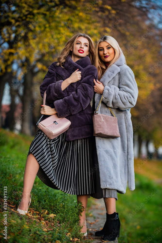 Gorgeous girls. Beauty and fashion concept. Difference between faux and ...