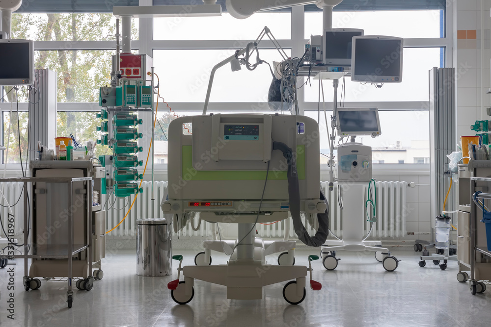 Intensive care unit in hospital, bed with monitors, ventilator, a place ...