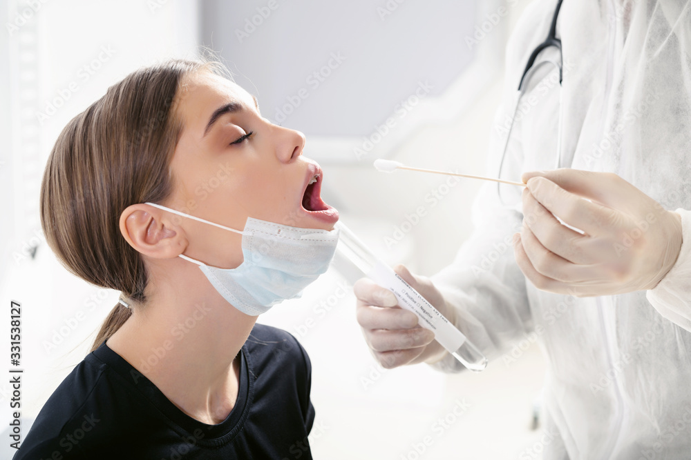 Doctor epidemiologist virologist takes a sample of biological material ...