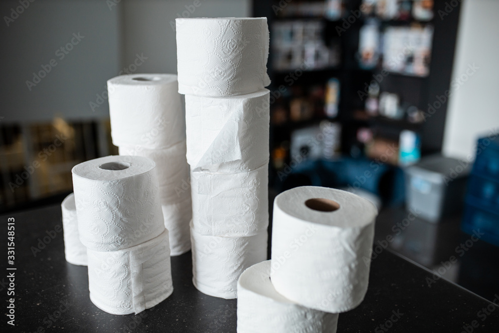 Toilet paper bunched up together on a counter in a home Stock Photo ...