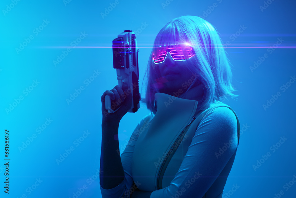 Girl with blaster in the futuristic battle. Concept virtual reality ...